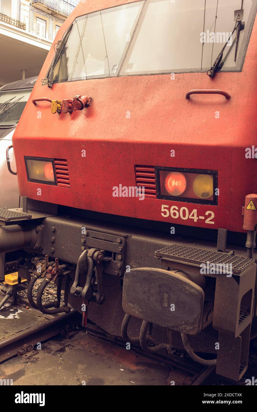 Red locomotive with burning red lights. Locomotive, front view ...