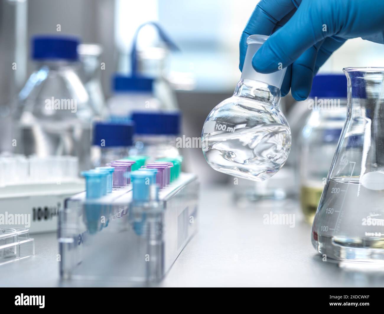 Scientist preparing a chemical formula during a experiment in the lab ...