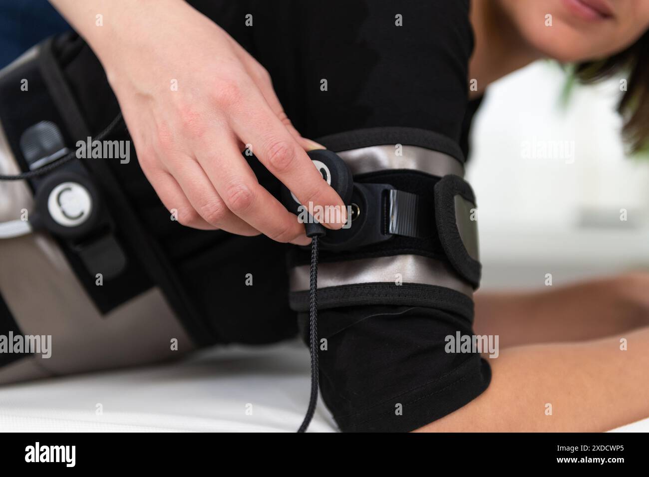 Electrical stimulation therapy for body contouring Stock Photo - Alamy