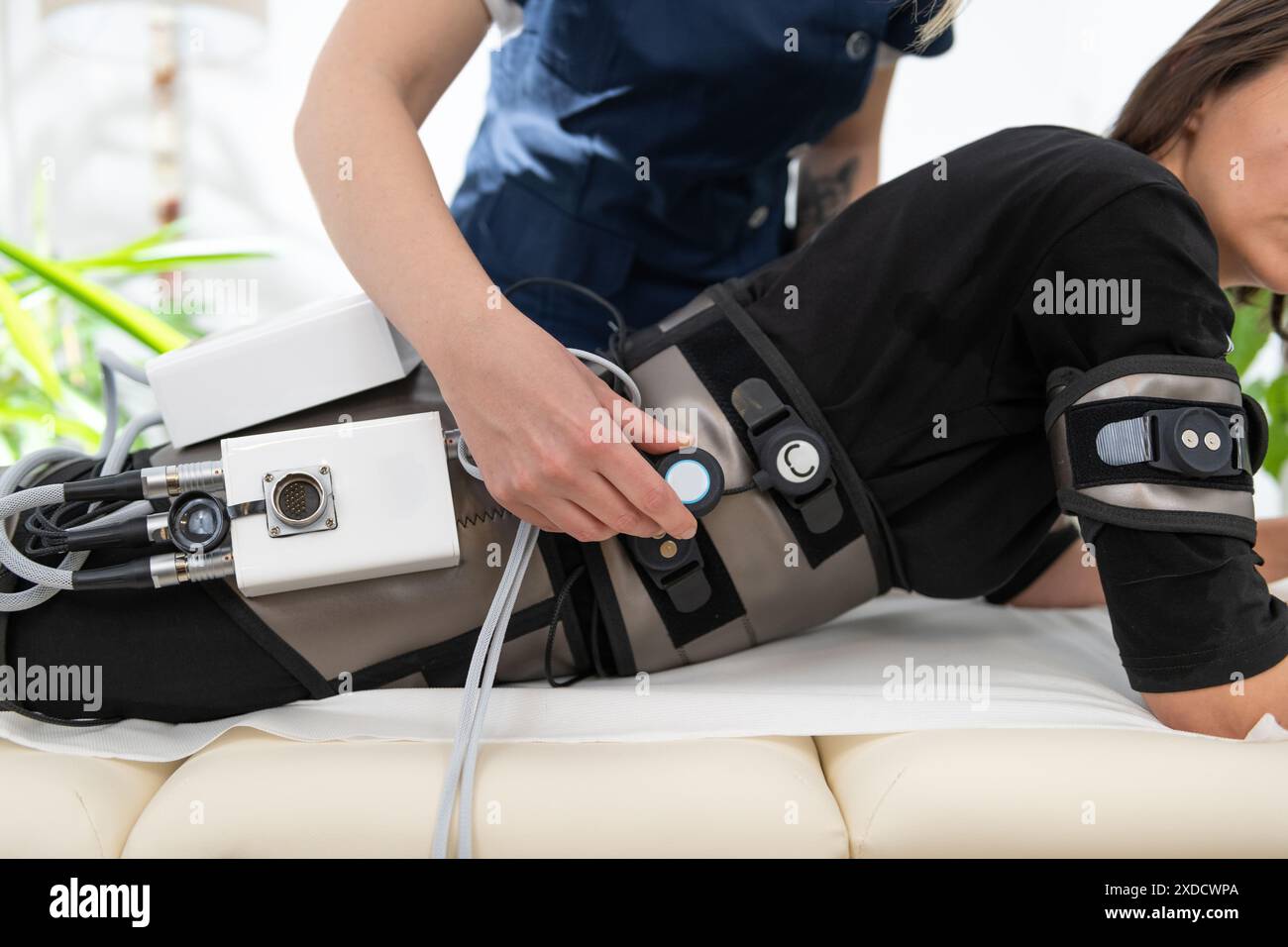 Electrical stimulation therapy for body toning Stock Photo - Alamy