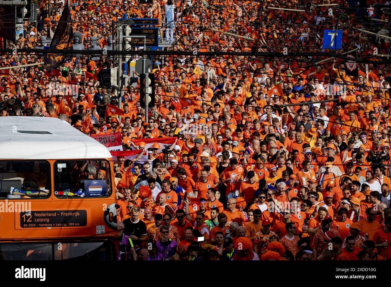 LEIPZIG - Dutch fans walk behind the Oranjebus during the fan walk to ...