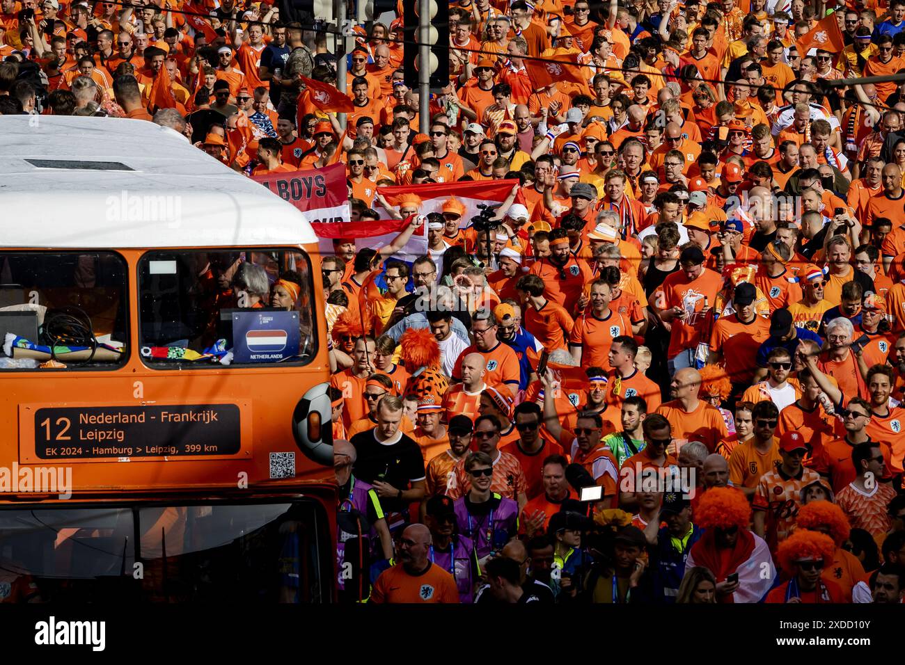 LEIPZIG - Dutch fans walk behind the Oranjebus during the fan walk to ...