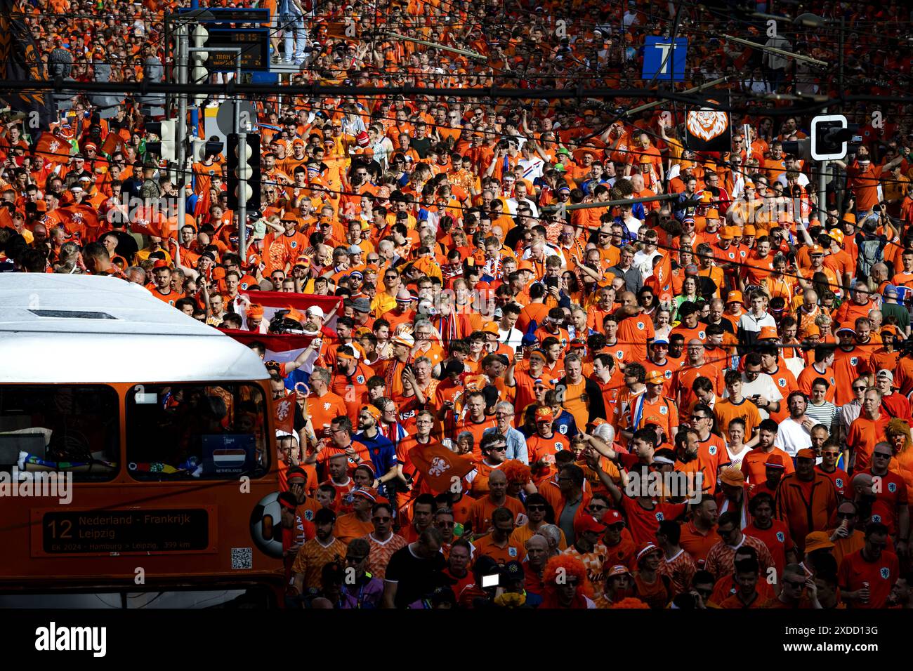 LEIPZIG - Dutch fans walk behind the Oranjebus during the fan walk to ...