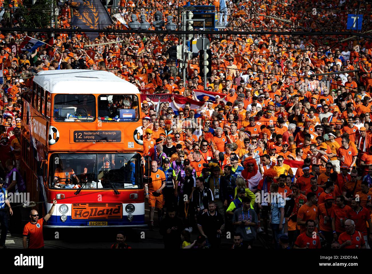 LEIPZIG - Dutch fans walk behind the Oranjebus during the fan walk to ...