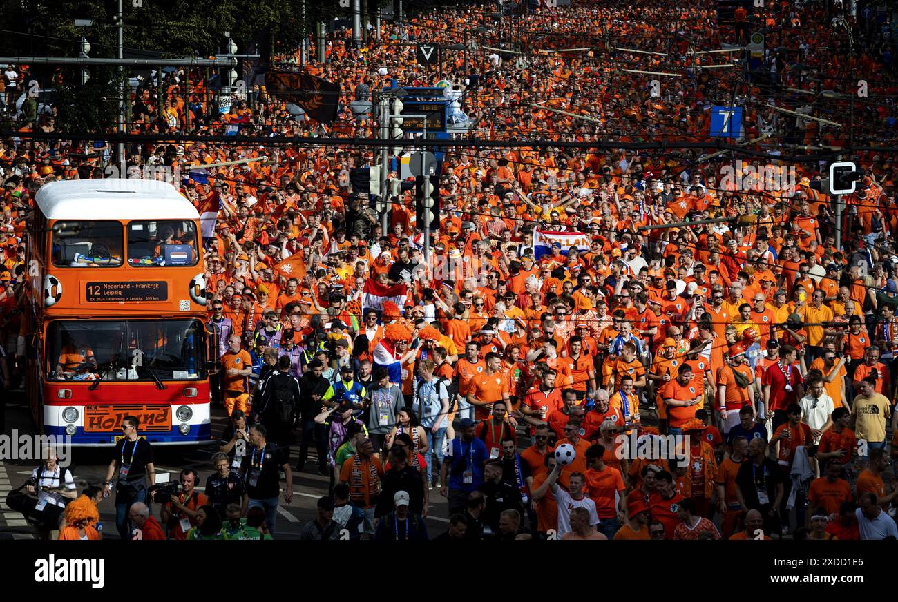 LEIPZIG - Dutch fans walk behind the Oranjebus during the fan walk to ...