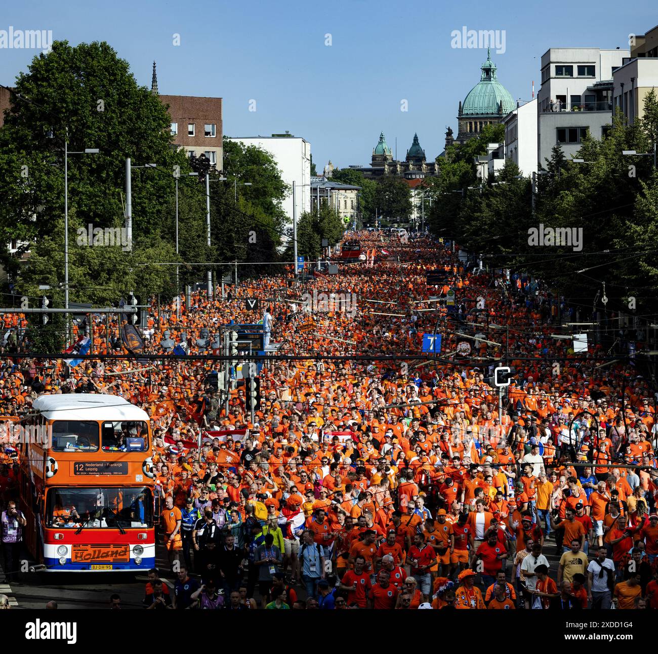 LEIPZIG - Dutch fans walk behind the Oranjebus during the fan walk to ...