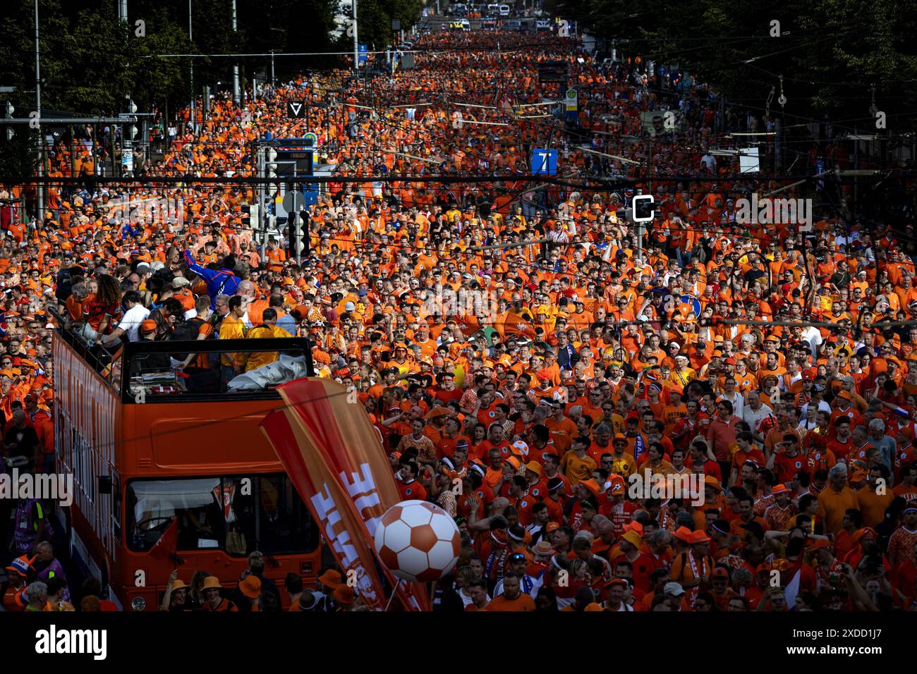 LEIPZIG - Dutch fans walk behind the Oranjebus during the fan walk to ...