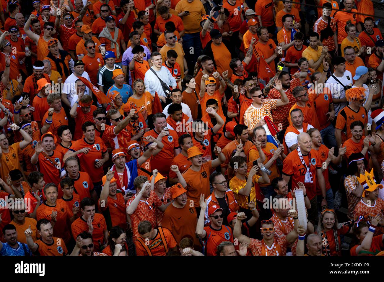 LEIPZIG - Dutch fans walk behind the Oranjebus during the fan walk to ...