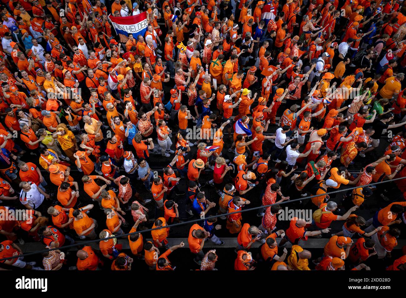 LEIPZIG - Dutch fans walk behind the Oranjebus during the fan walk to ...