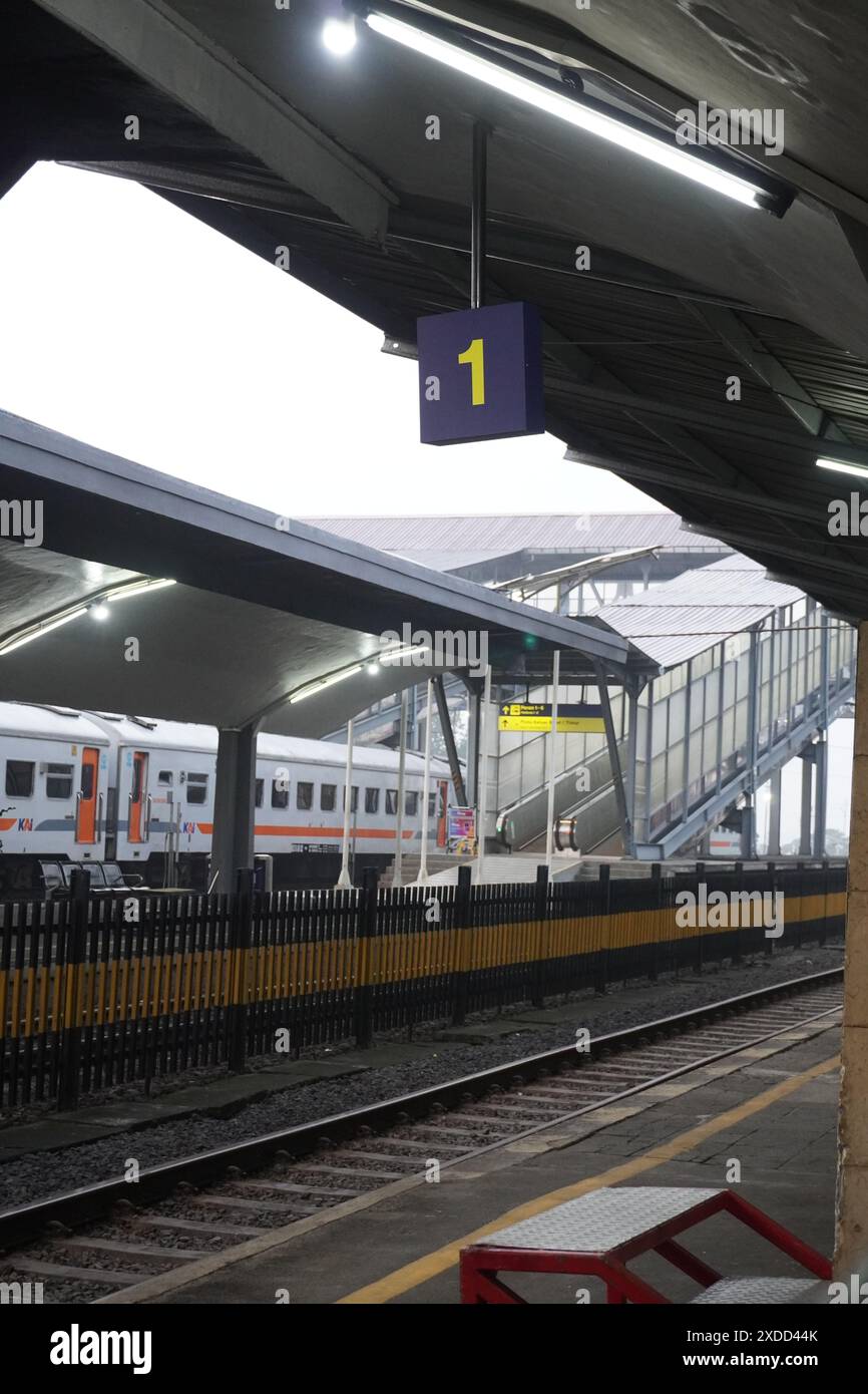Sign of empty number one train line in the morning at an Indonesian ...