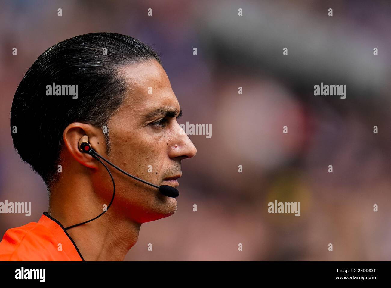 DUSSELDORF, GERMANY - JUNE 21: fourth official Serdar Gozubuyuk looks ...