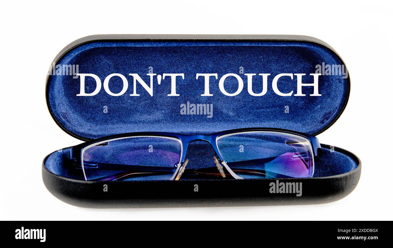 Words DO NOT TOUCH written symbol on the inside of the glasses case on ...