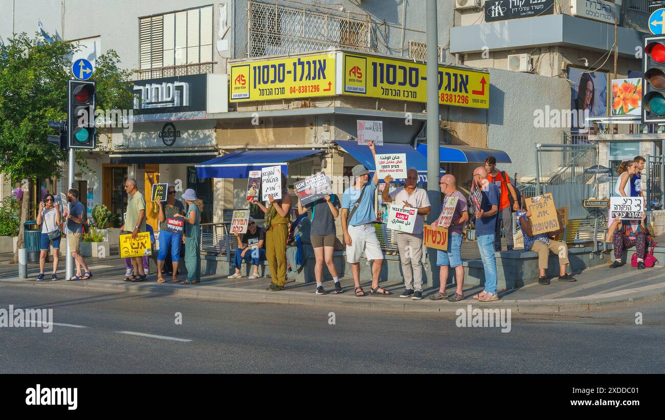 Haifa, Israel - June 20, 2024: People with signs calling for peace talk ...
