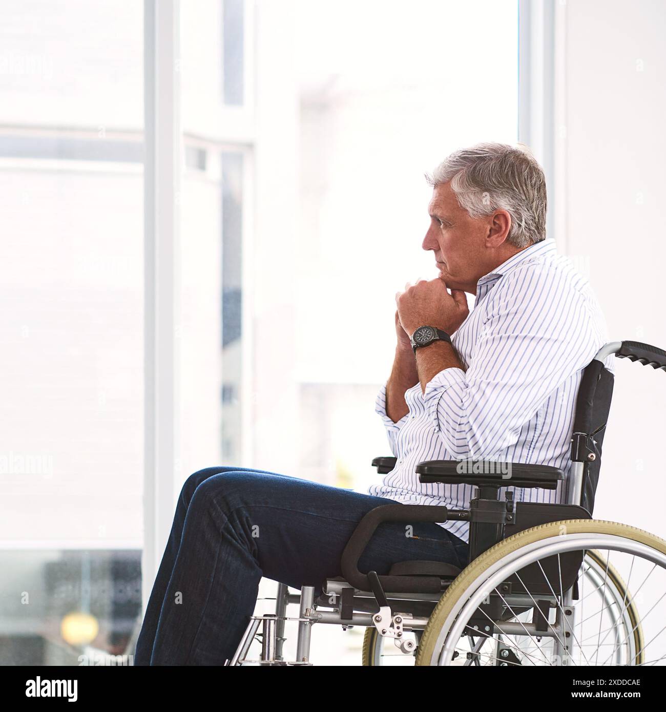 Wheelchair, senior man and hospital with thinking about surgery ...