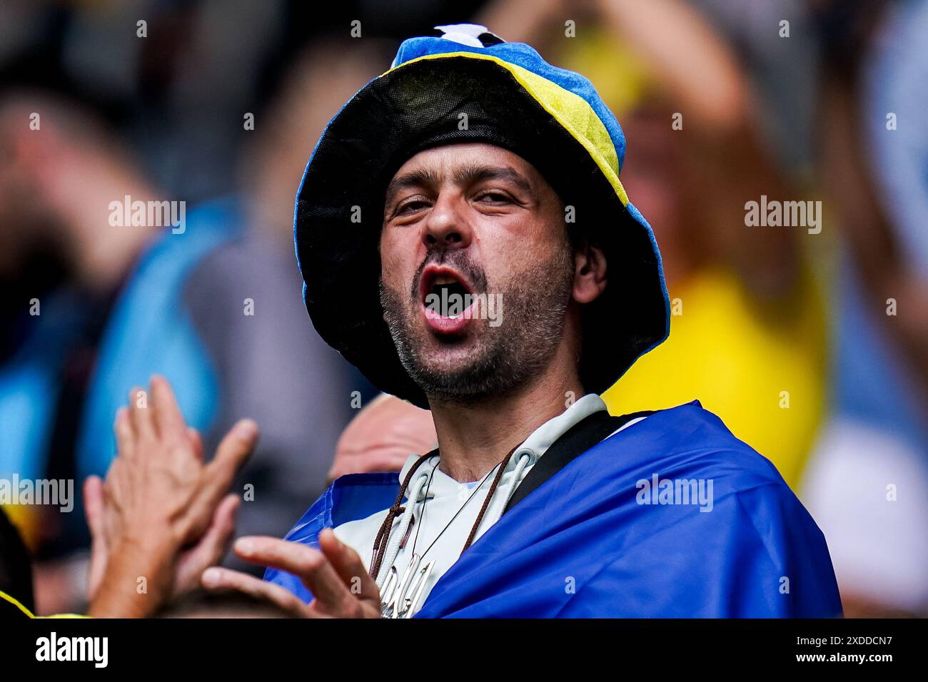 DUSSELDORF, GERMANY - JUNE 21: A supporter of Ukraine cheers prior to ...