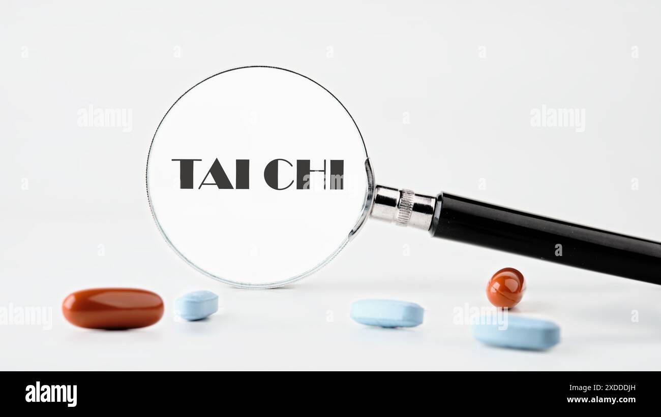 Sports and signal. Sign tai chi through a magnifying glass on a light ...