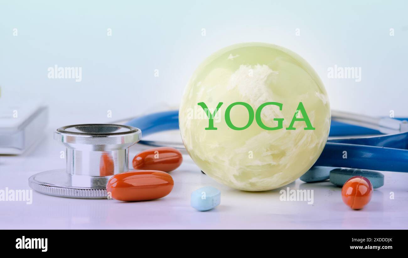 YOGA concept. Word YOGA written on a ball on a blue background with ...