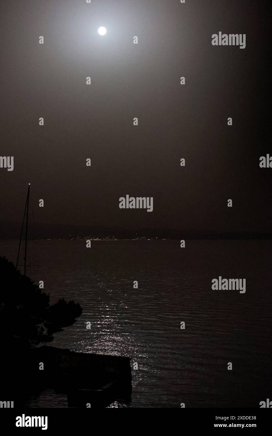 Split, Croatia. 21st June, 2024. View of the full moon and summer ...