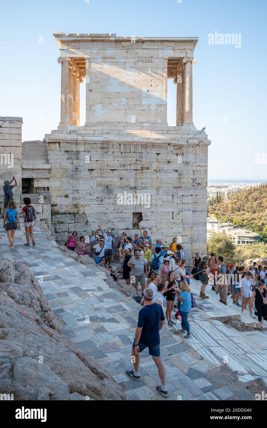 Tourists visiting the Acropolis of Athens, main ancient sightseeing ...