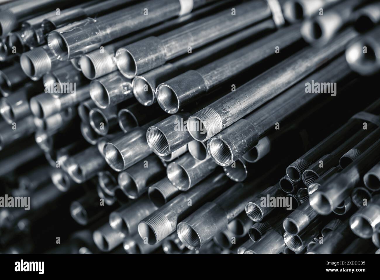 metal gas pipe store stack pile on shelf black and white vintage color ...