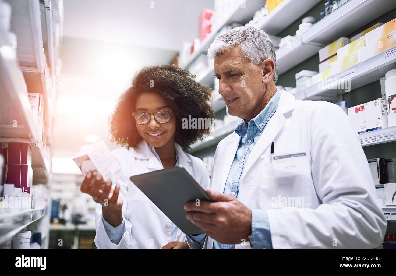 Tablet, discussion and pharmacists with medication in chemist for ...