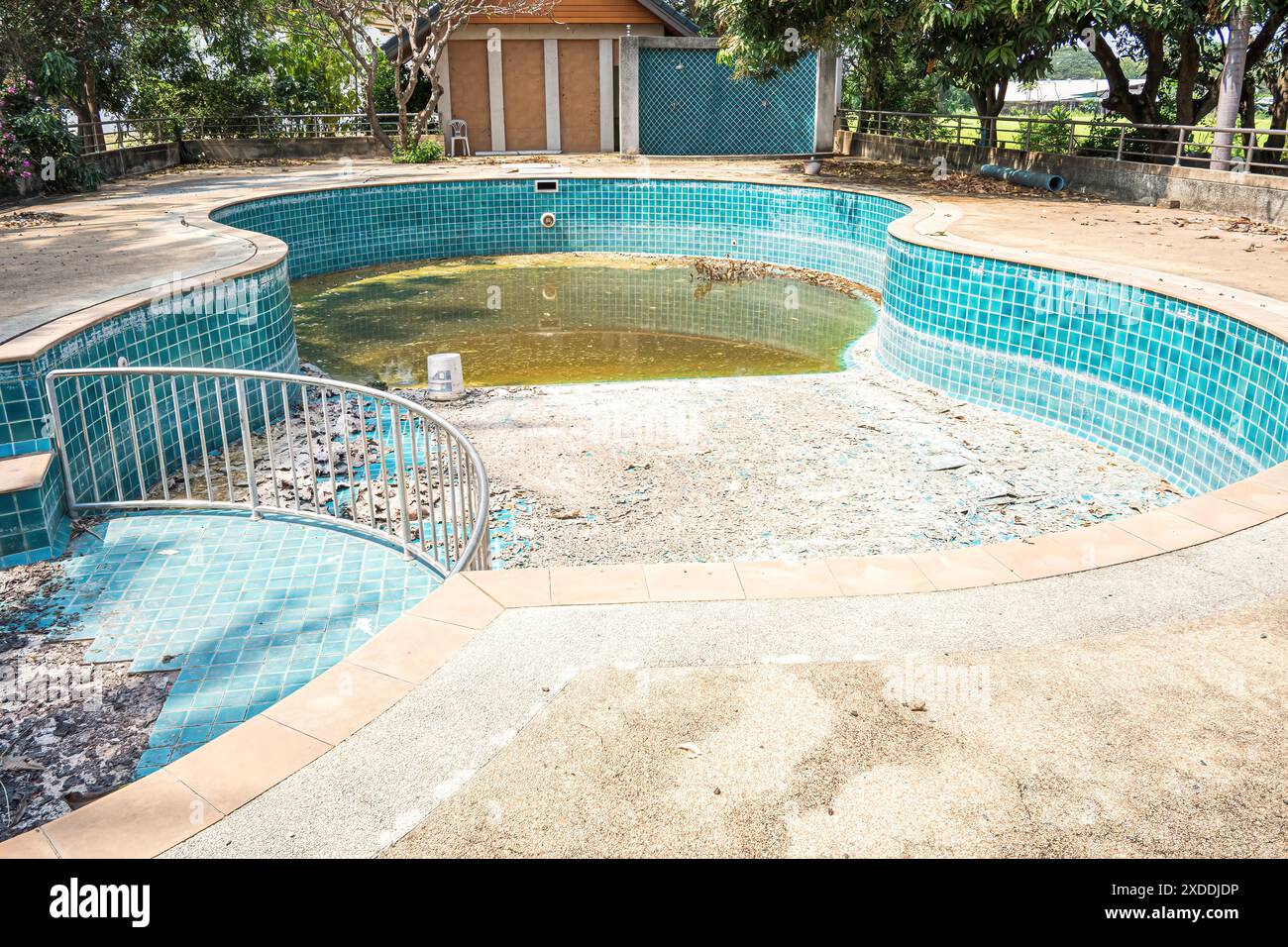 Abandoned swimming pool in the garden house Stock Photo - Alamy