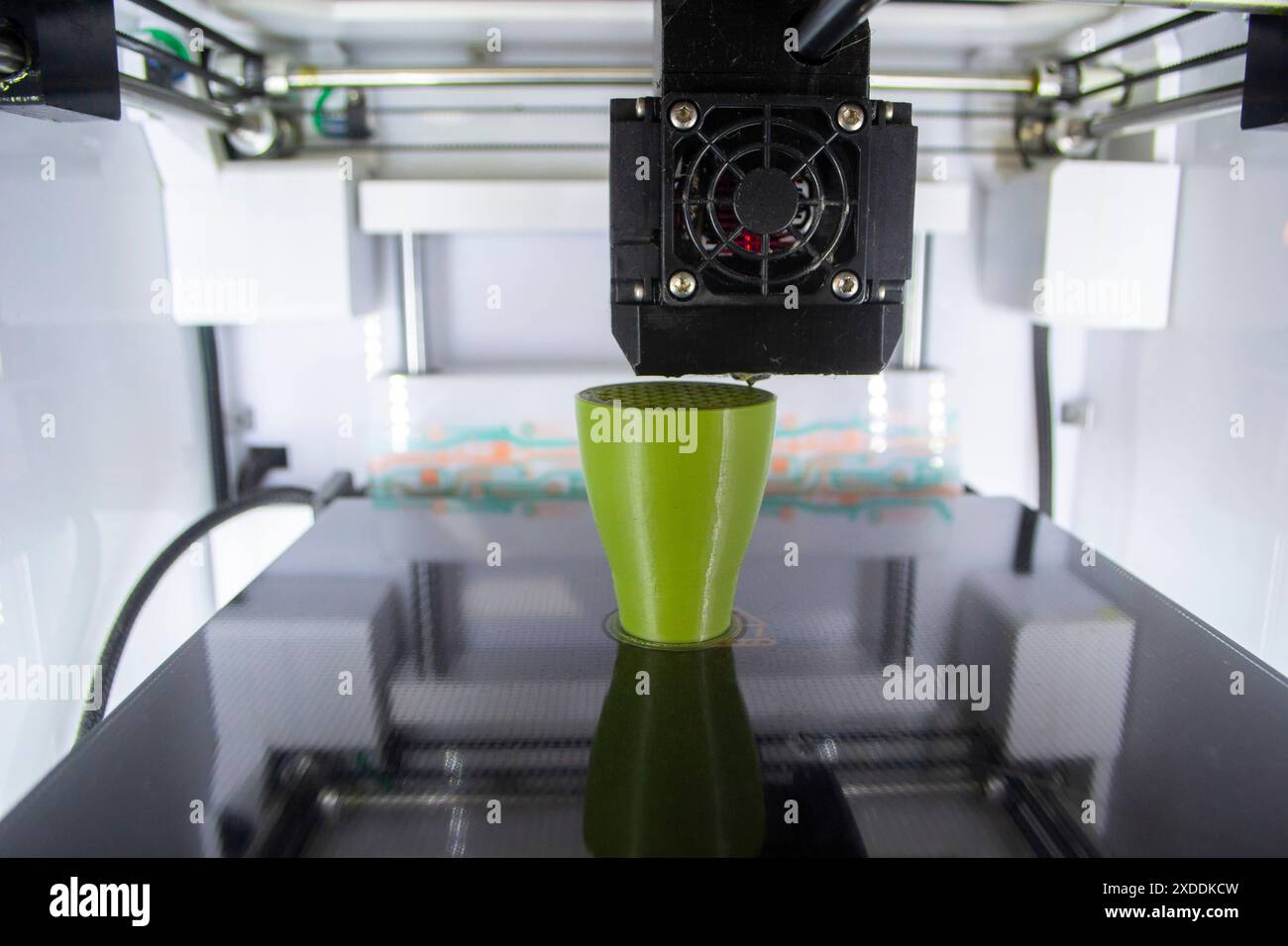 3D printer close up. A working 3D printer in process of printing object ...