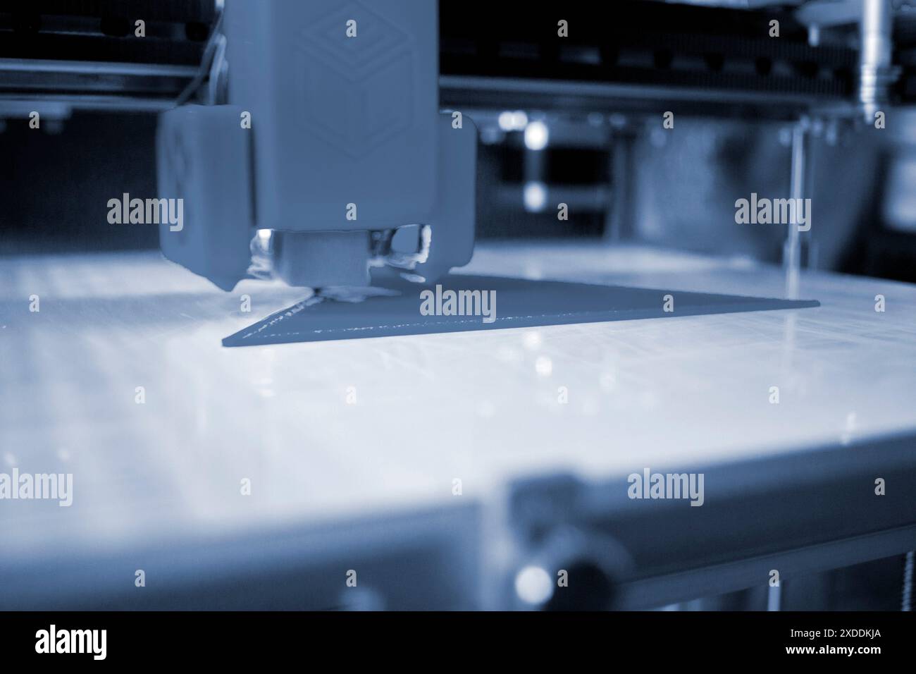 3D printer close up. A working 3D printer in process of printing object ...