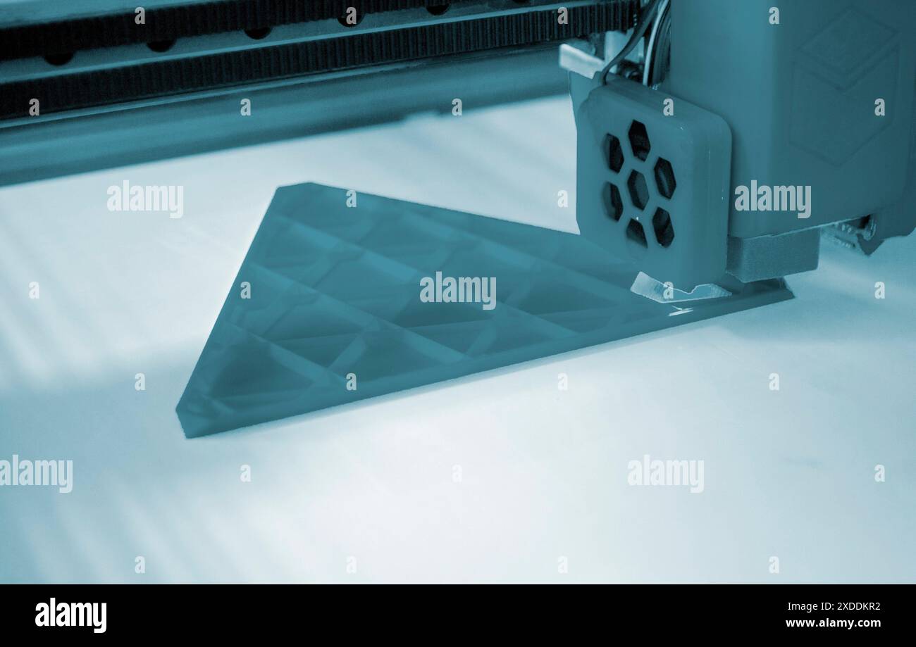 3D printer close up. A working 3D printer in process of printing object ...