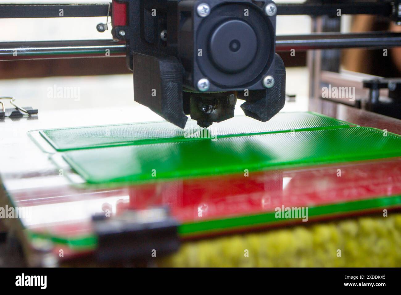 3D printer close up. A working 3D printer in process of printing object ...