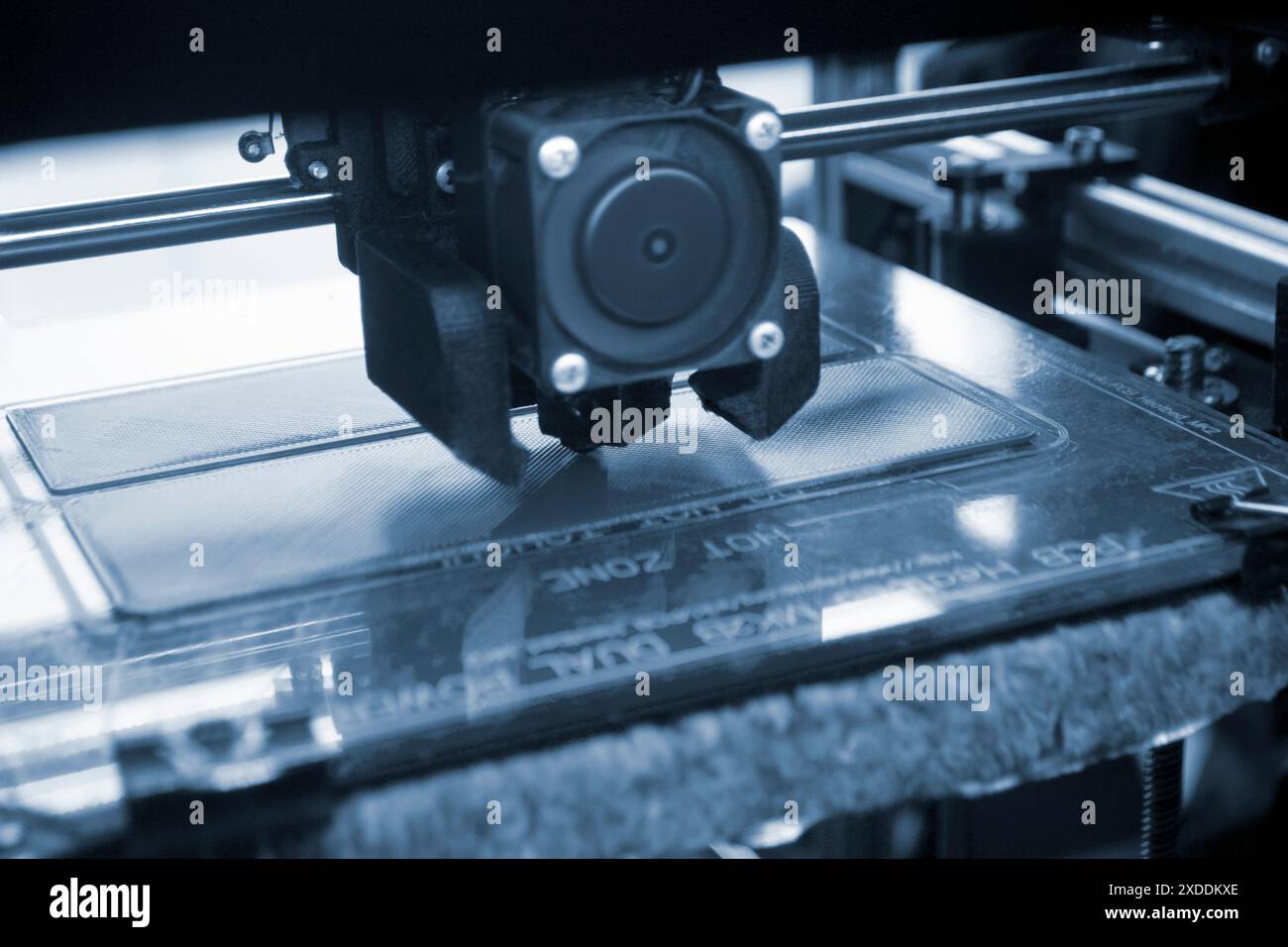 3D printer close up. A working 3D printer in process of printing object ...