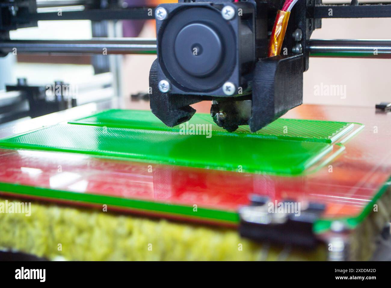 3D printer close up. A working 3D printer in process of printing object ...