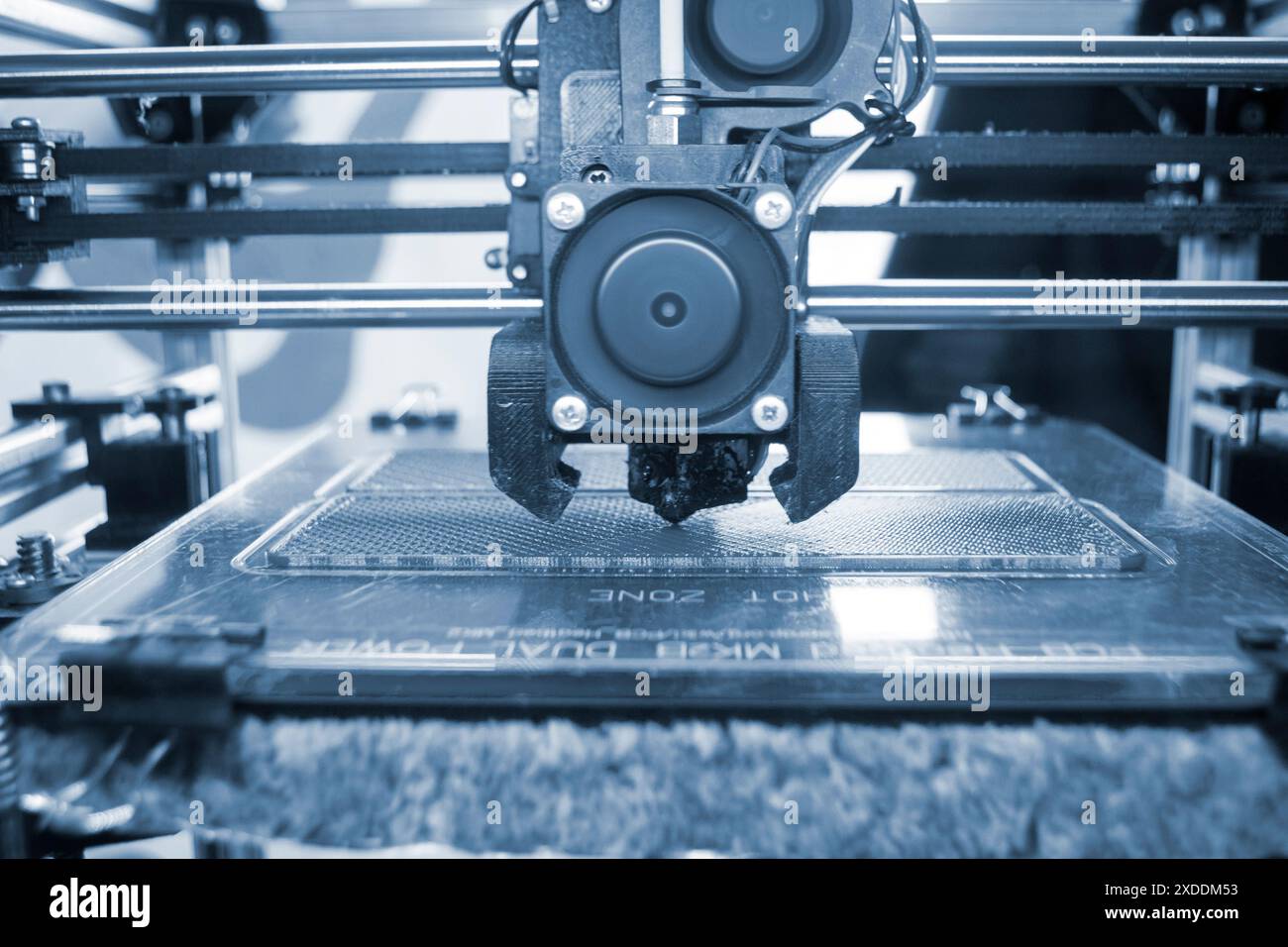 3D printer close up. A working 3D printer in process of printing object ...