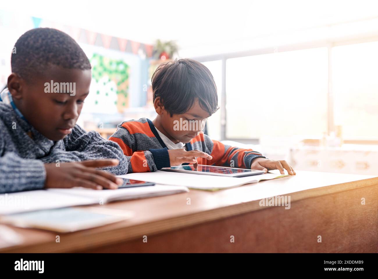 Tablet, school and children in classroom for online learning, project ...