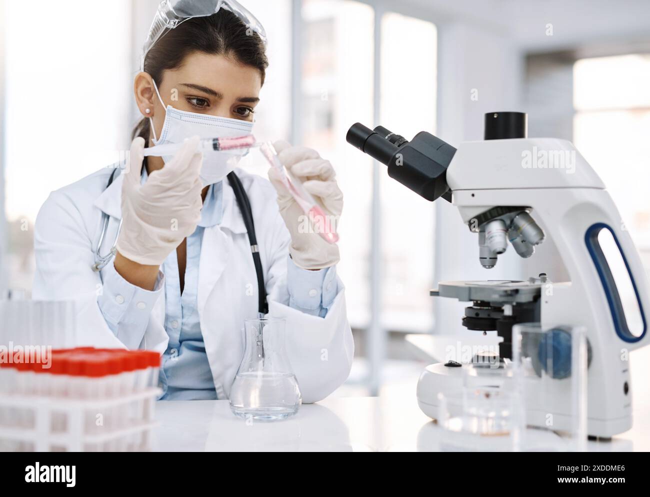 Vial, lab research and woman scientist in hospital with syringe for ...