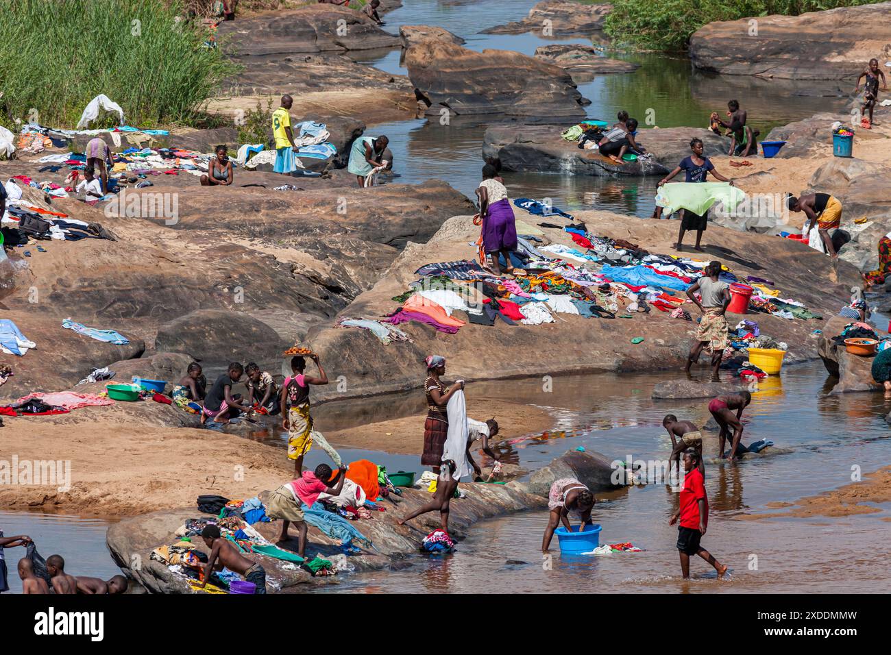 Mozambique, Nampula, Monapo, Washing the clothes and bathing in the ...