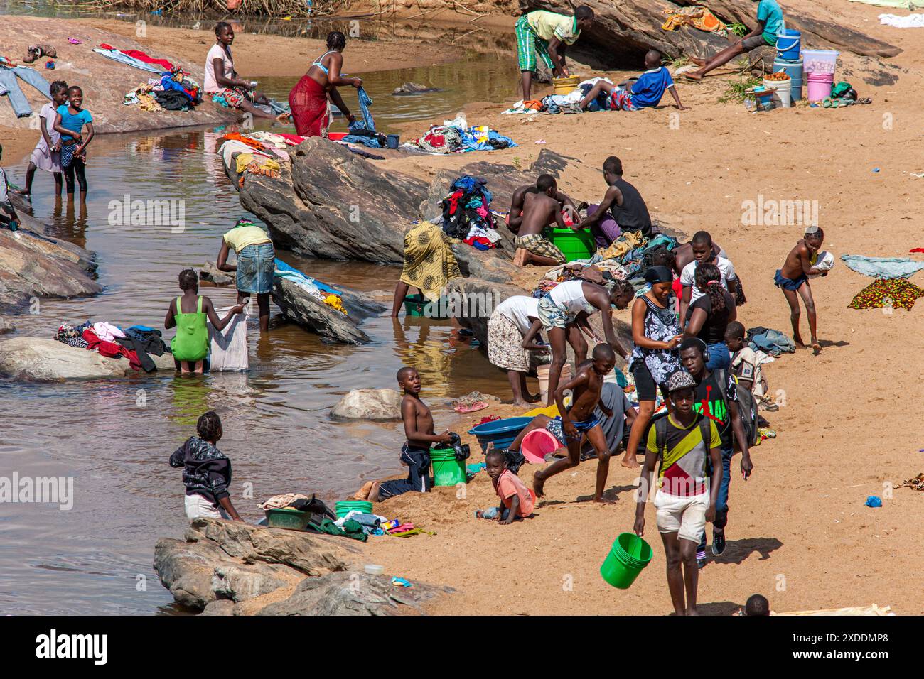 Mozambique, Nampula, Monapo, Washing the clothes and bathing in the ...