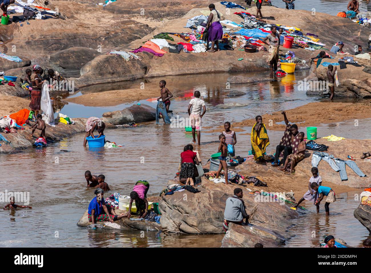 Mozambique, Nampula, Monapo, Washing the clothes and bathing in the ...