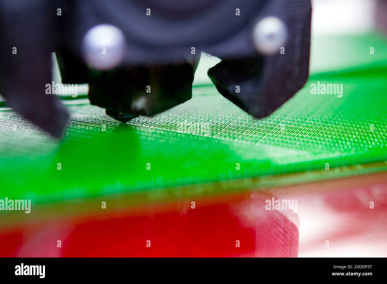 3D printer close up. A working 3D printer in process of printing object ...