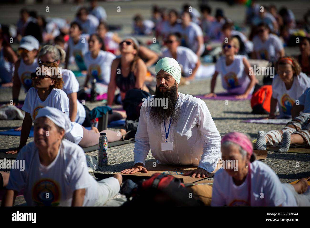 Dozens of people during a yoga master class for the 10th anniversary of ...
