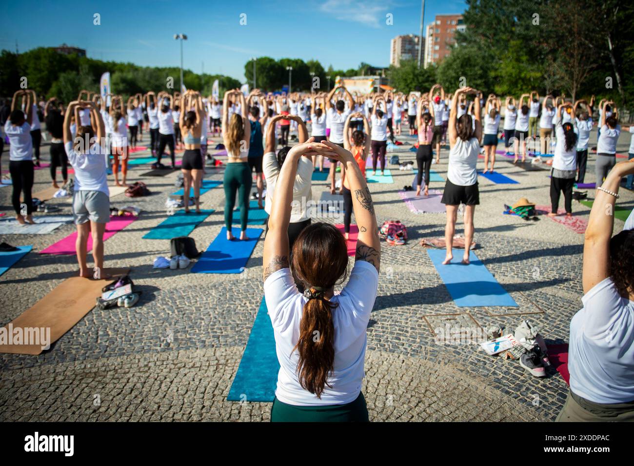 Dozens of people during a yoga master class for the 10th anniversary of ...
