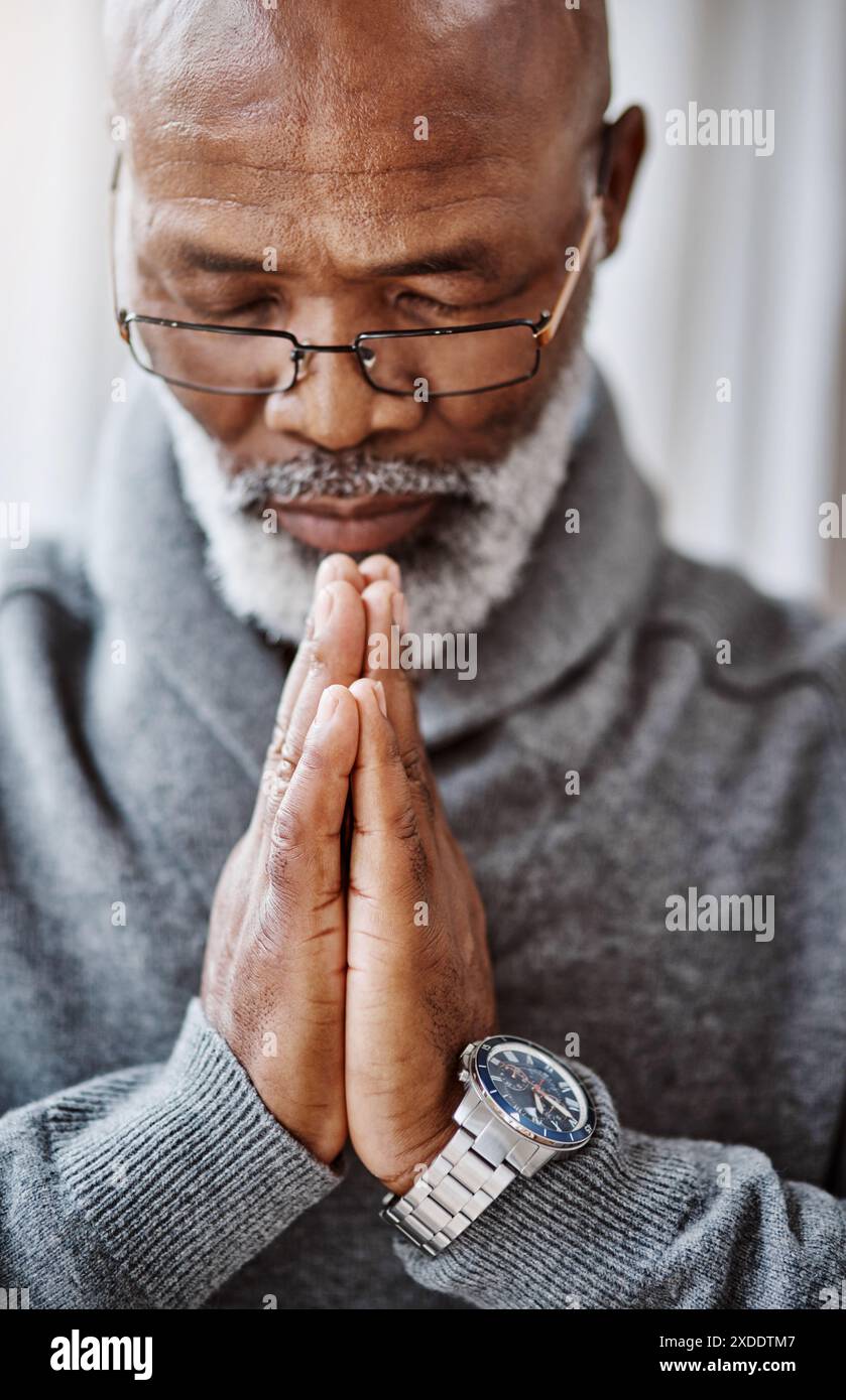 Senior man in glasses praying hi-res stock photography and images - Alamy