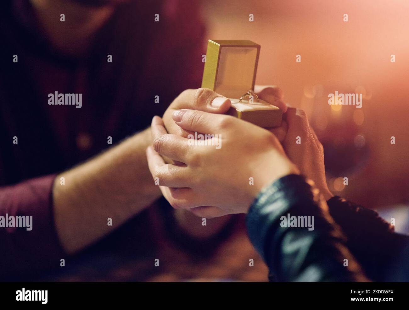 Box, hands and proposal with couple in restaurant together for ...
