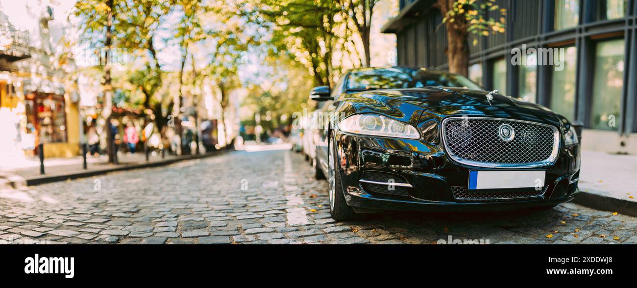 Jaguar XJ X351 parker on city street. The Jaguar XJ is a series of mid ...