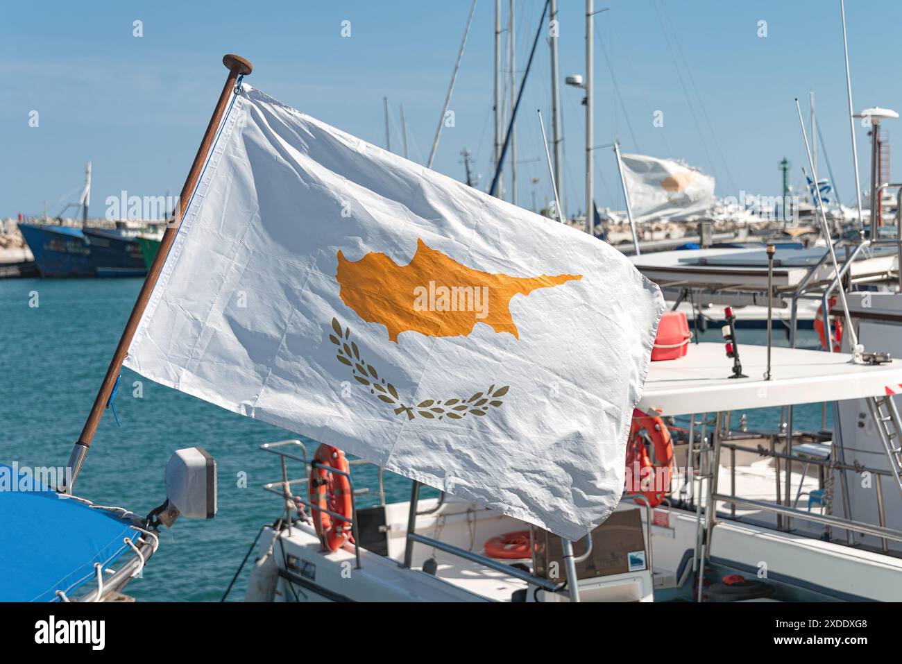 The national flag of Cyprus is waving in the wind. Limassol old port ...