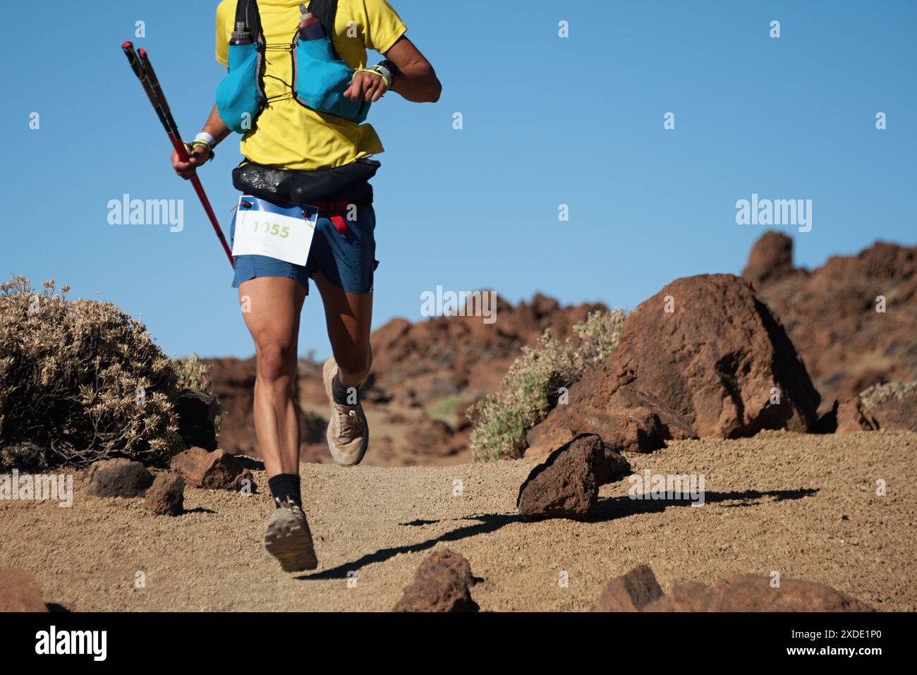 Trail running runner man on endurance run with hydratation trail vest ...