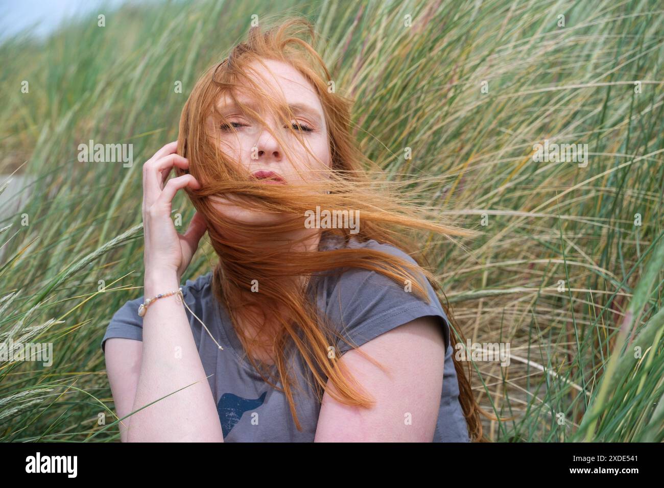 Hair blown in face by wind hi-res stock photography and images - Alamy