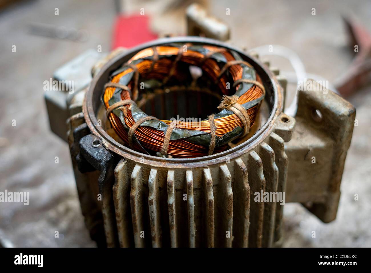 Inside of a disassembled machine containing a round copper coil Stock ...