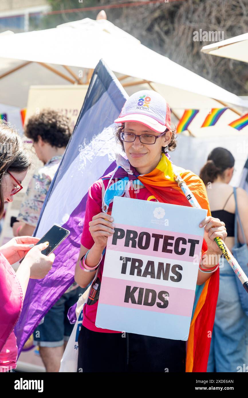 Haifa, Israel June 21, 2024, Pride. A young man wrapped in a trans flag ...