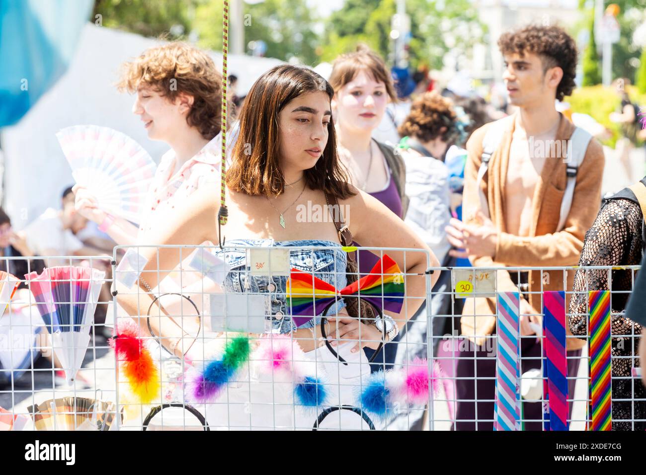Haifa, Israel June 21, 2024, Pride Parade. A girl chooses a purchase at ...